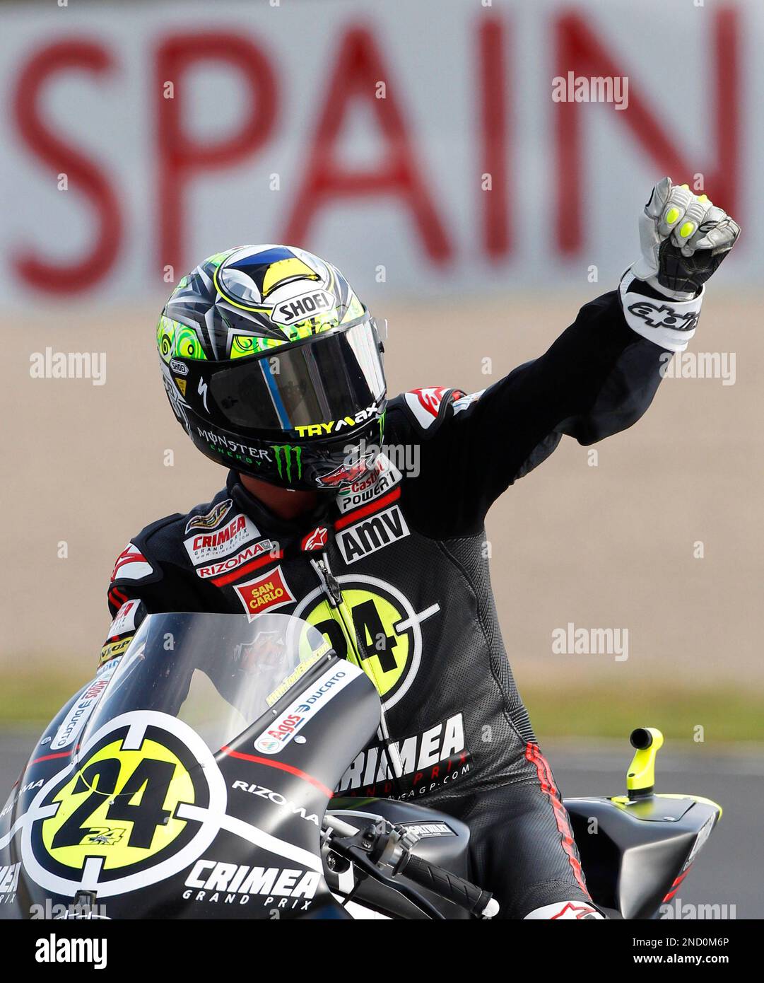 Spanish Moto2 rider Toni Elias on his Moriwaki raises an arm in ...