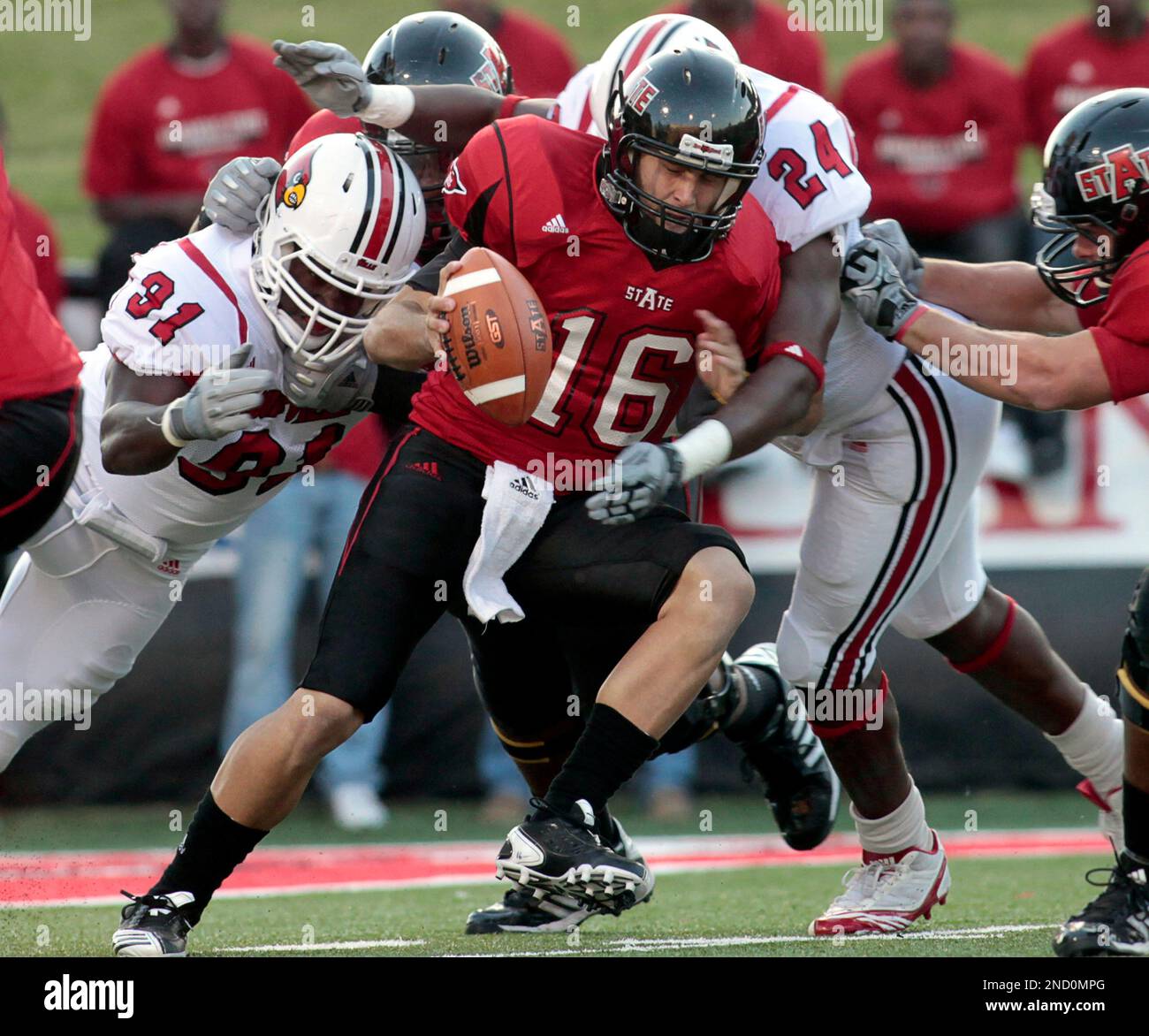 Arkansas State quarterback Ryan Aplin (16) is sacked by Louisville ...