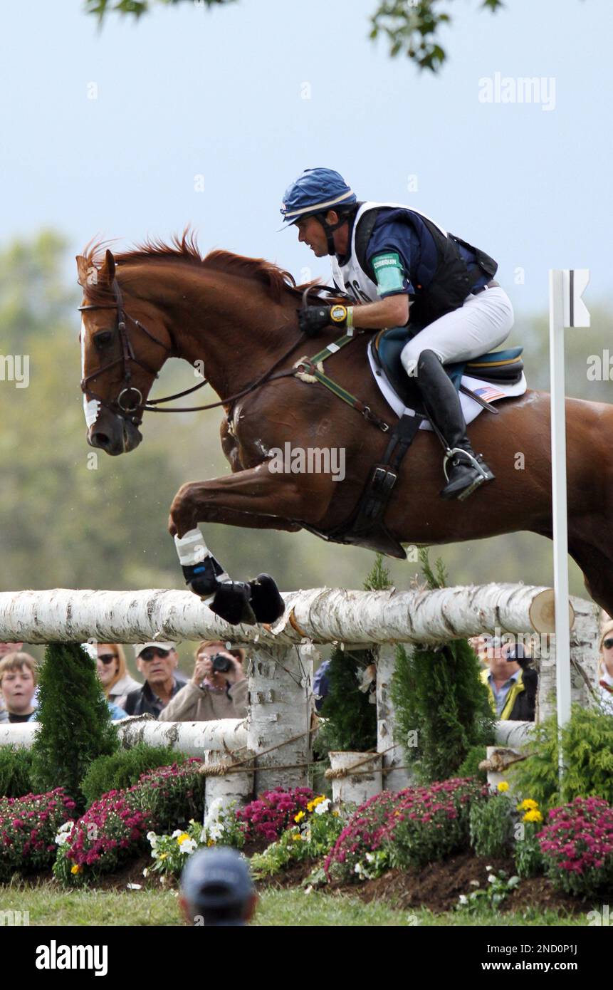 Phillip Dutton, of the United States, rides Woodburn during the cross ...