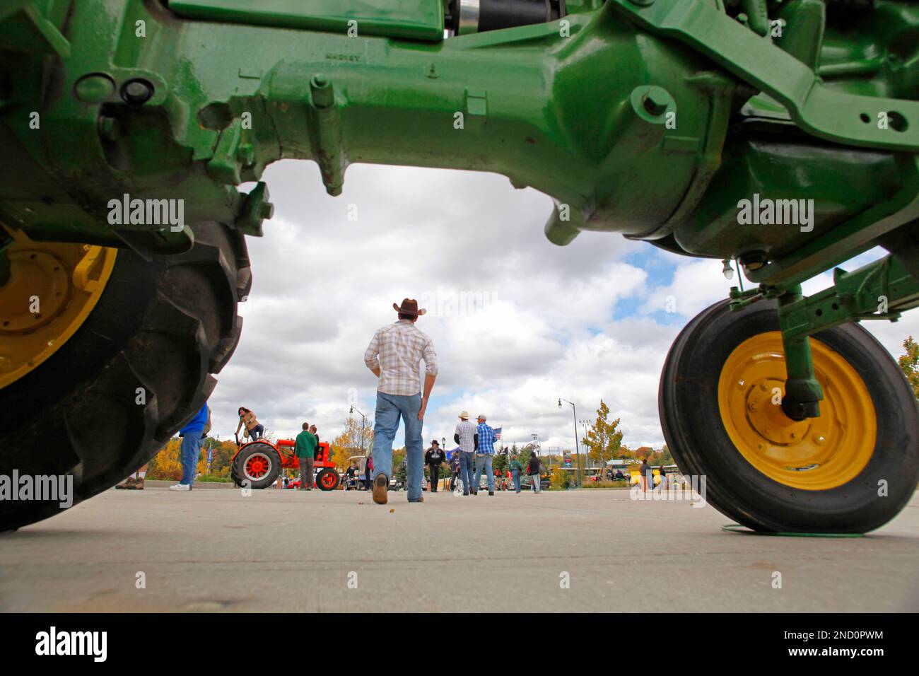 A 1958 John Deere tractor is on display in the parking lot of the 25th ...