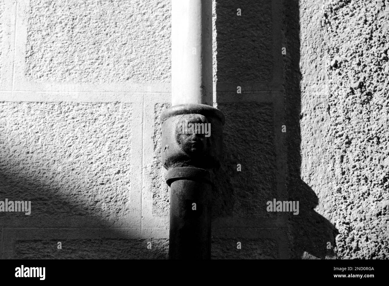 Face on old forged metal gutter in Finestrat. Modernist style Stock ...