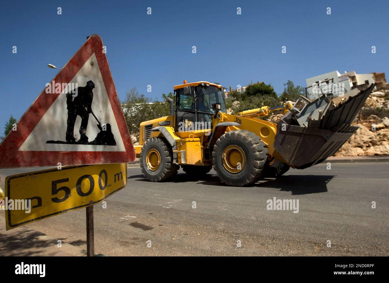 In this photo taken Tuesday, Sept. 28, 2010, workers drive ground ...