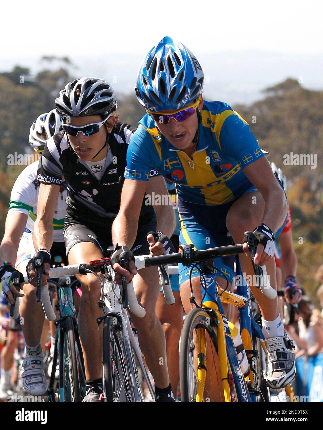 Sweden's Emma Johansson, right, races on her way to a third place ...