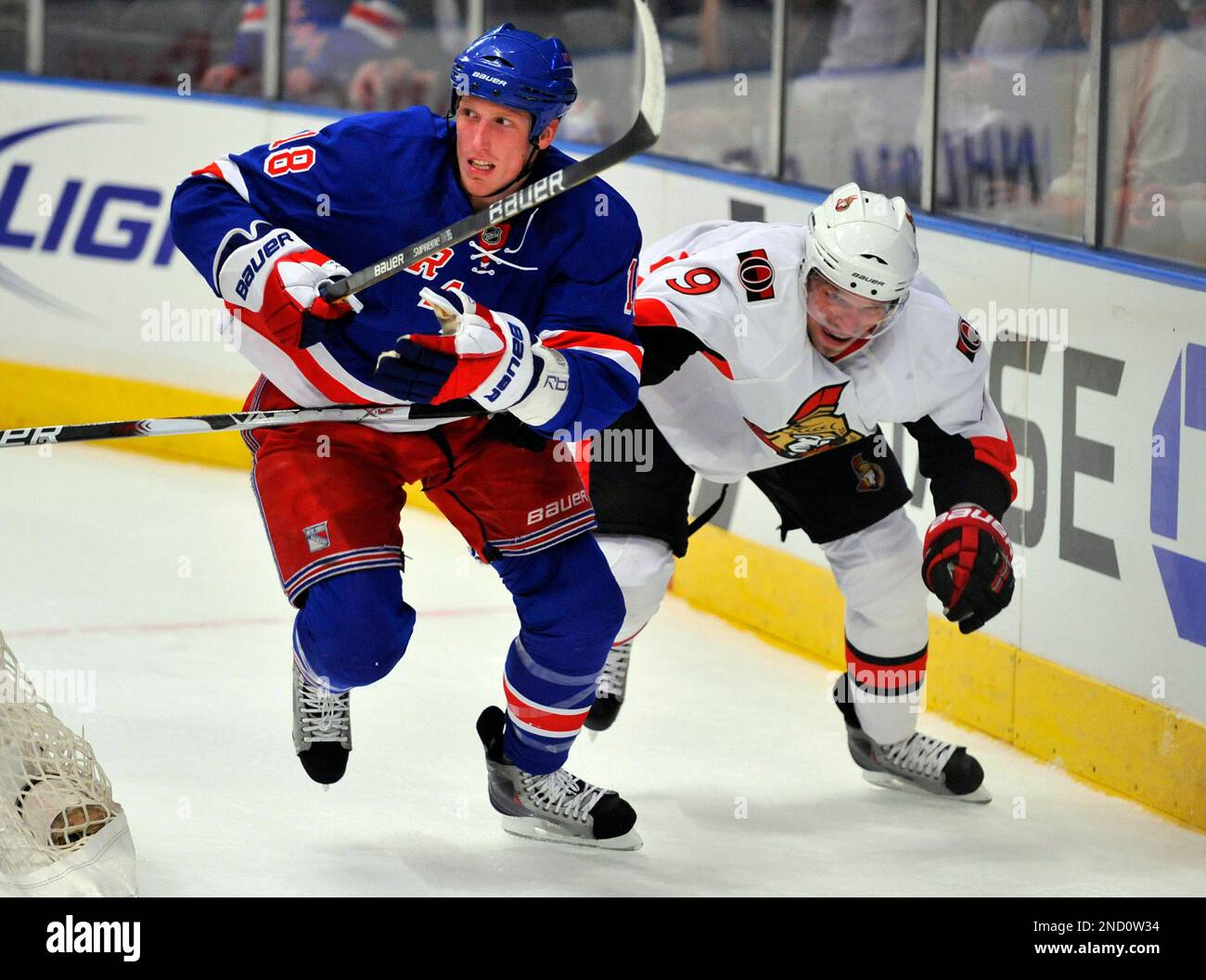 New York Rangers' Marc Staal, left, battles for the puck with Ottawa ...