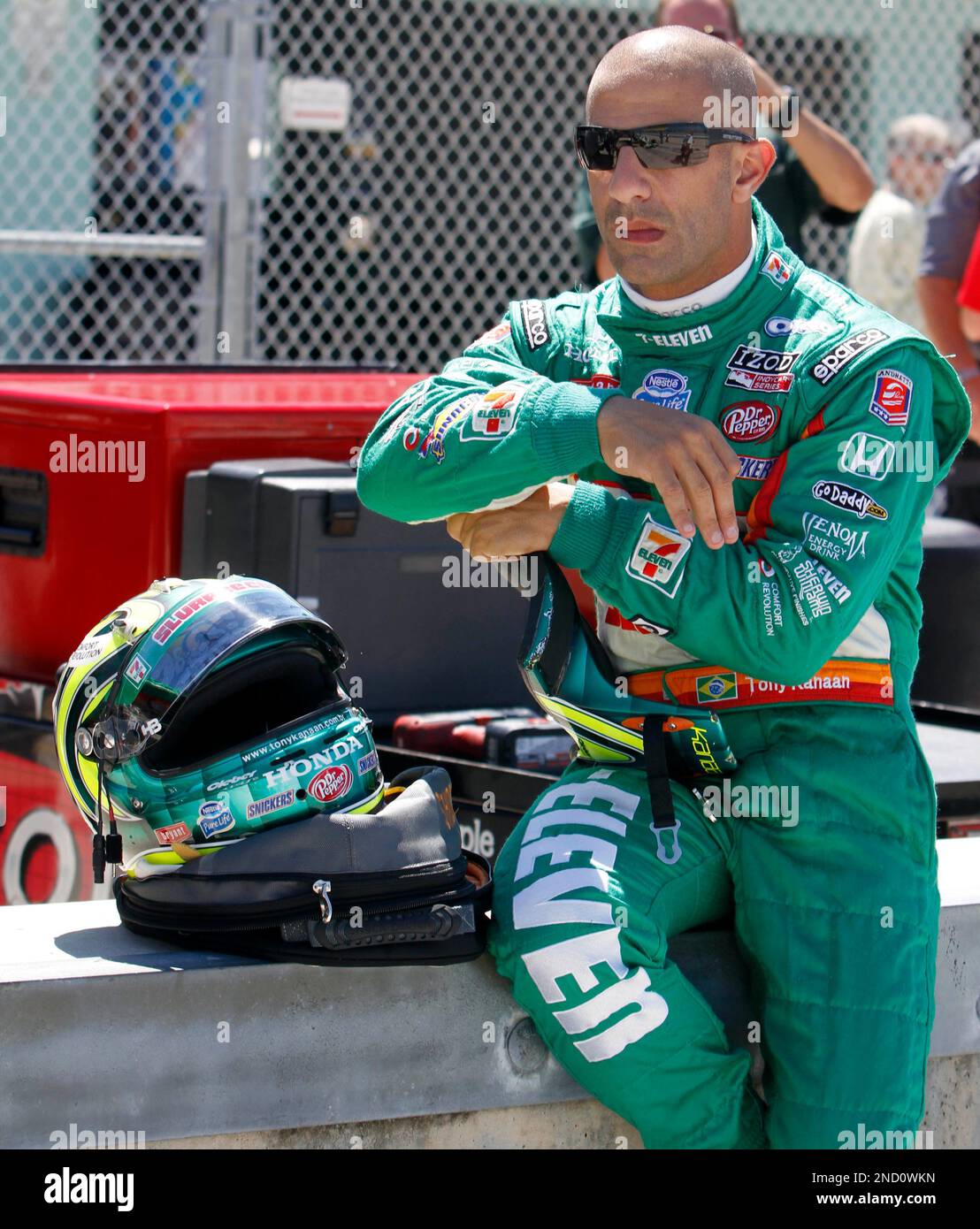 Indy car driver Tony Kanaan, of Brazil, sits on the wall before ...