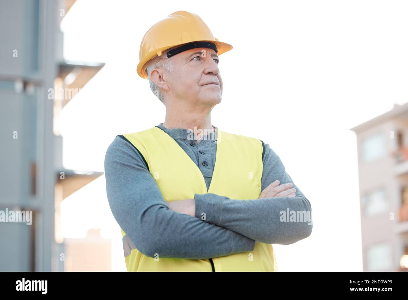 Construction worker, old man and architecture, building industry and ...