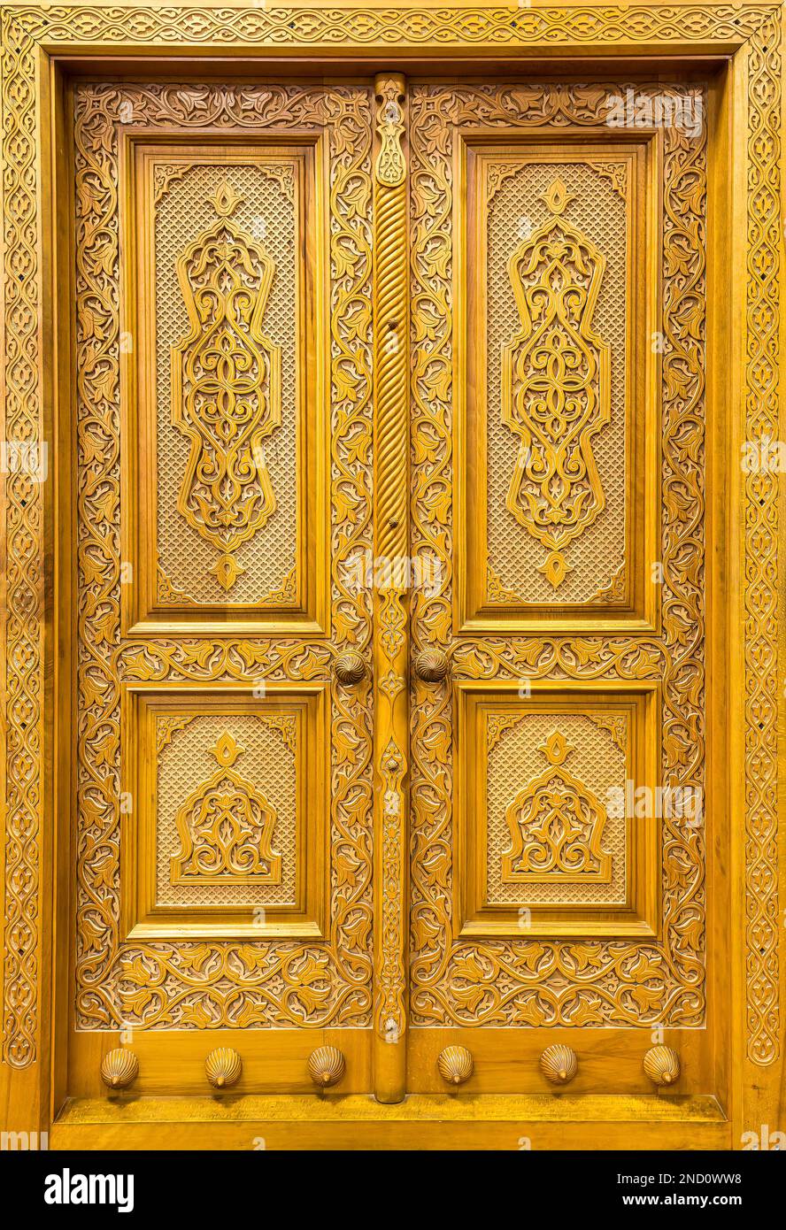 Carved antique wooden doors with patterns and mosaics. Abstract ...