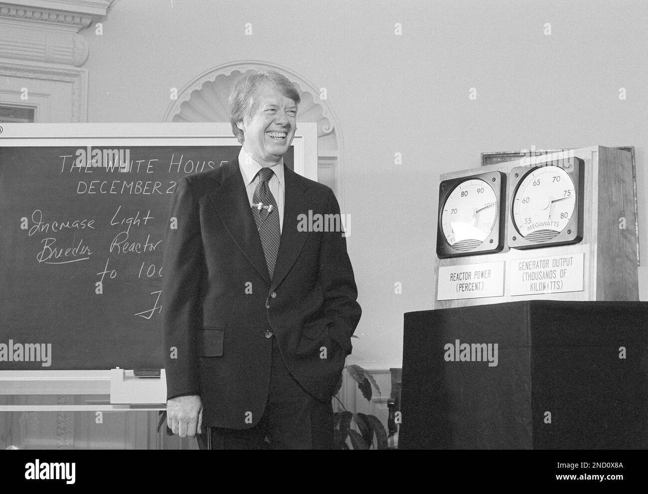 President Jimmy Carter watches power meters after writing a message on ...