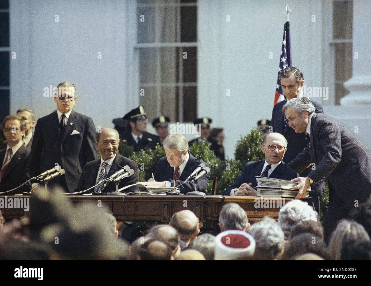 President Jimmy Carter signing copy of peace treaty between Egypt and ...