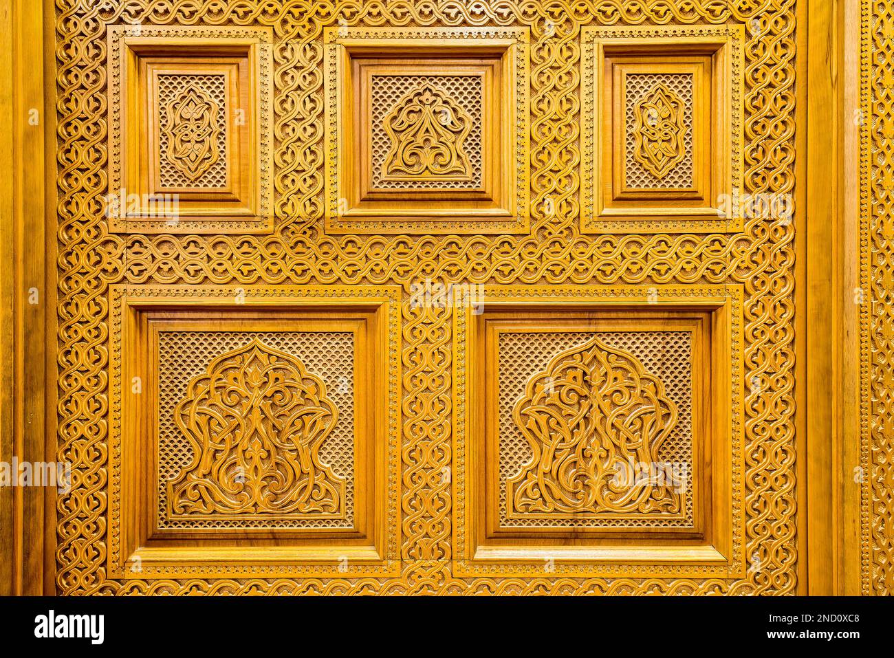 Carved antique wooden doors with patterns and mosaics. Abstract ...