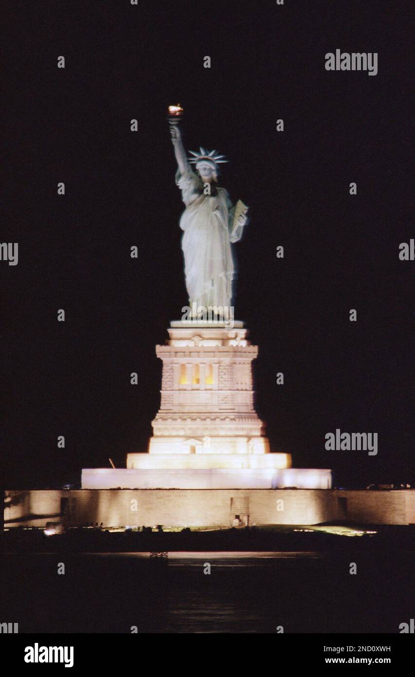 The Statue of Liberty is lit up in New York Harbor on June 29, 1986 ...