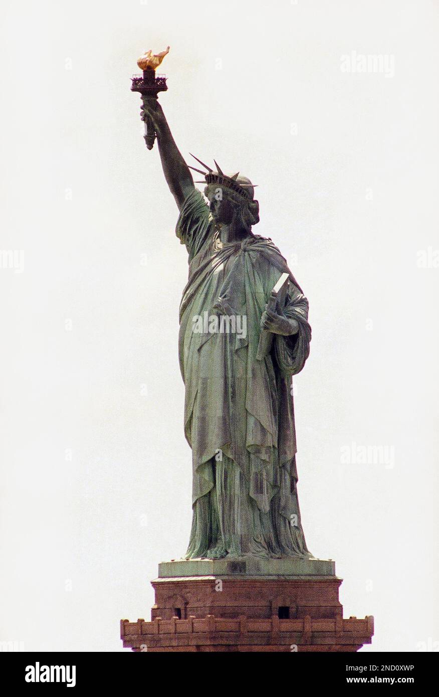 The Statue of Liberty looks out on New York Harbor during the ...