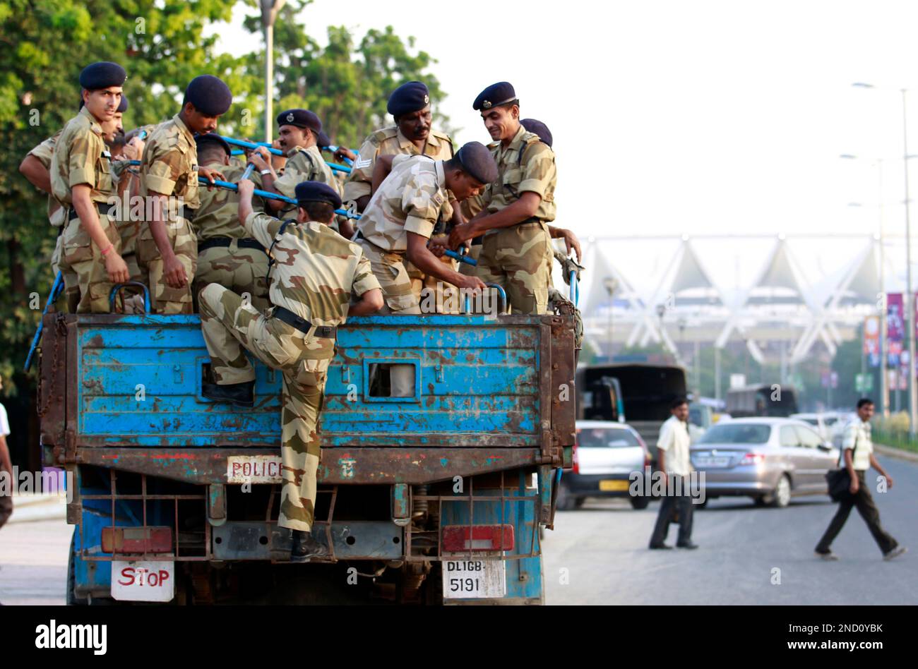Indian police officers are seen aboard a truck outside the Jawaharlal ...