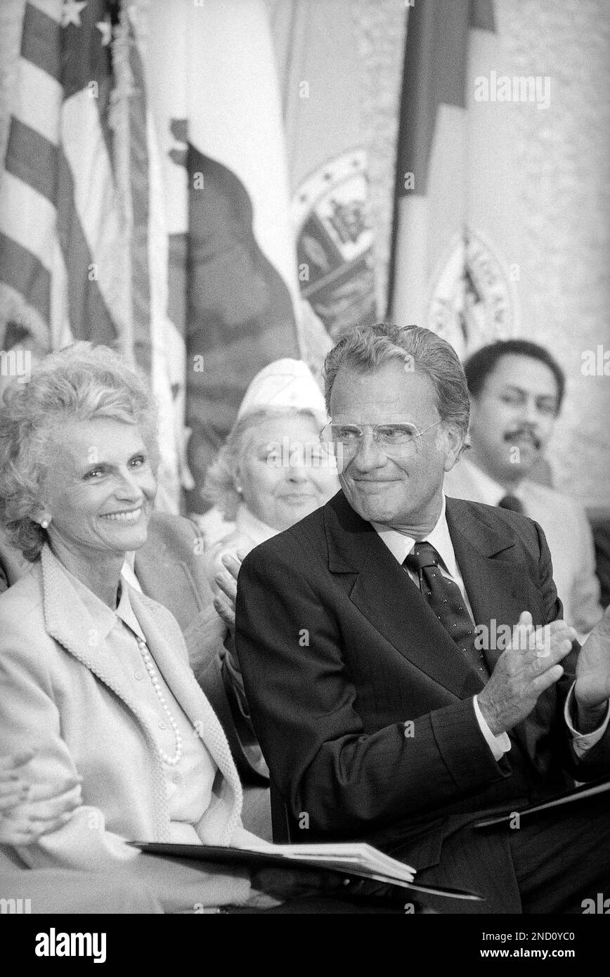 Rev. Billy Graham, right, joins in the applause for his wife, Ruth ...