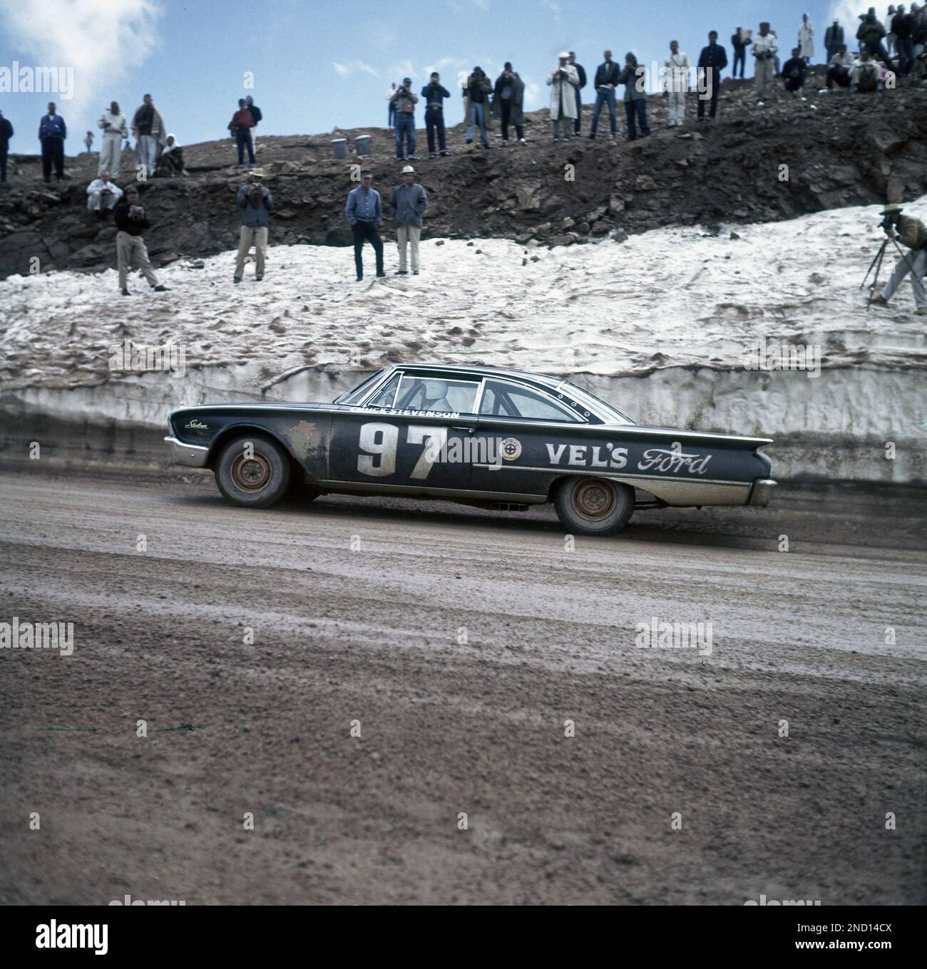 Unidentified cars making Pikes Peak hill climb during auto racing in ...