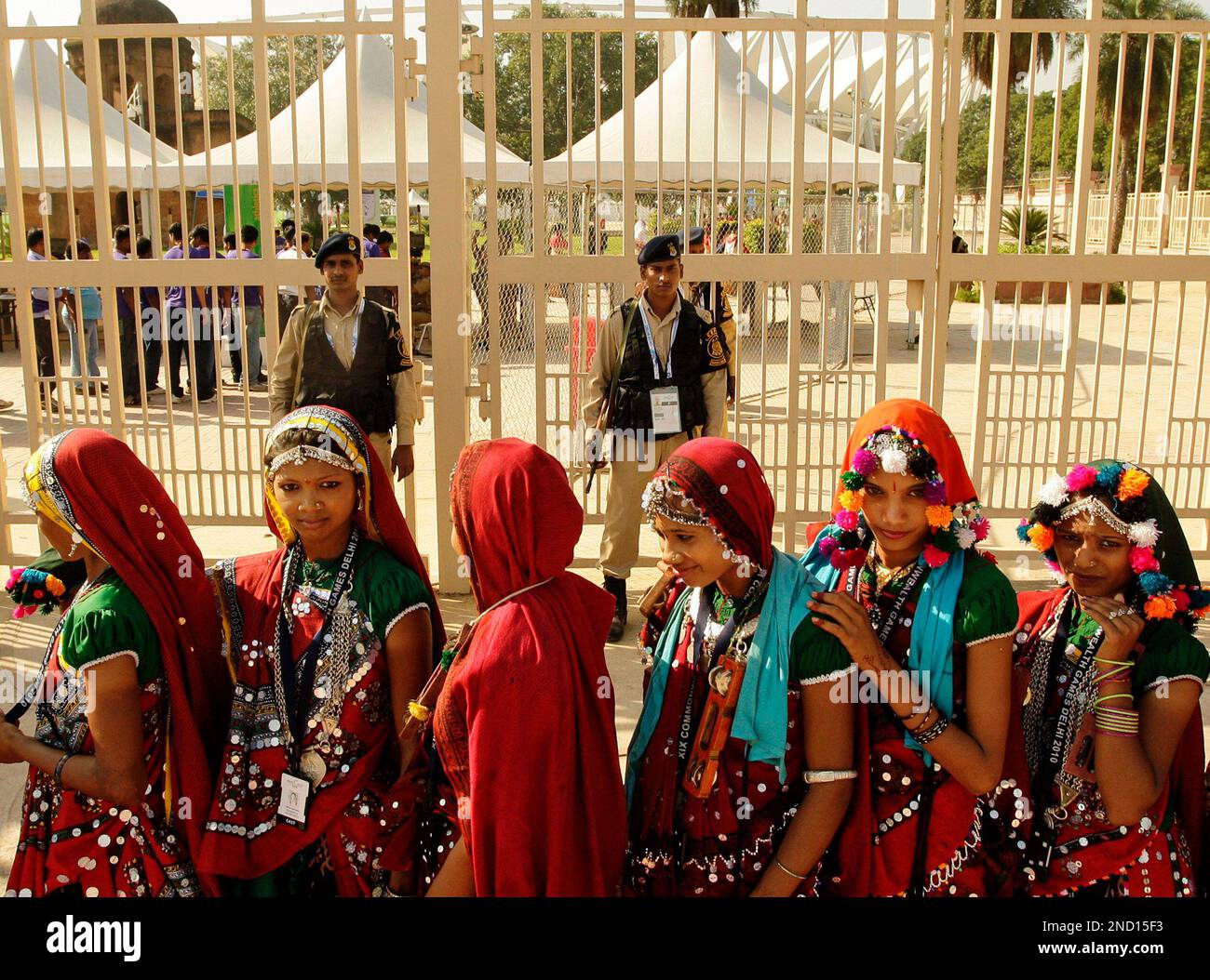 Folk performers wearing traditional dress queue outside the Jawaharlal ...