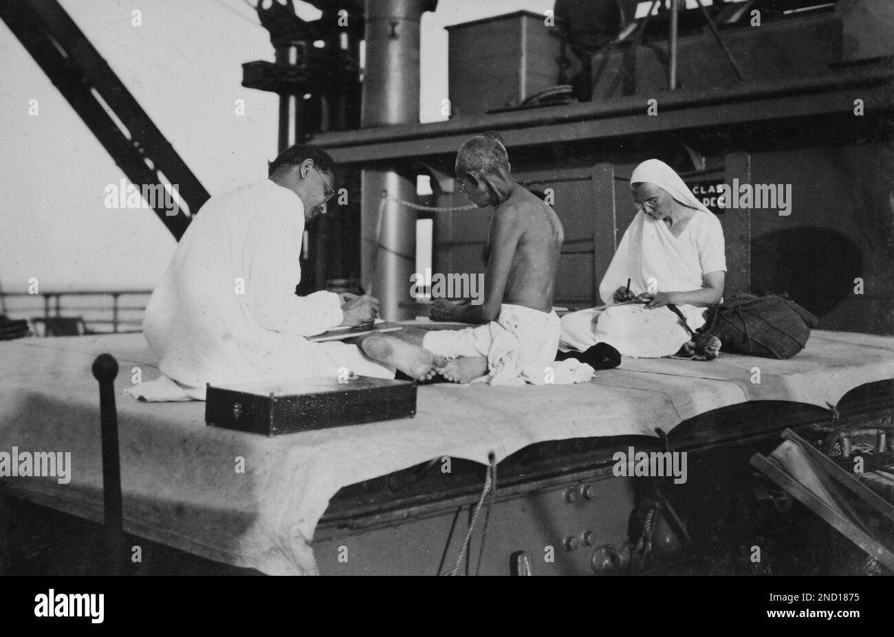 Mahatma Gandhi speaking with Mahadev Desai aboard the S.S. Rajputana en ...
