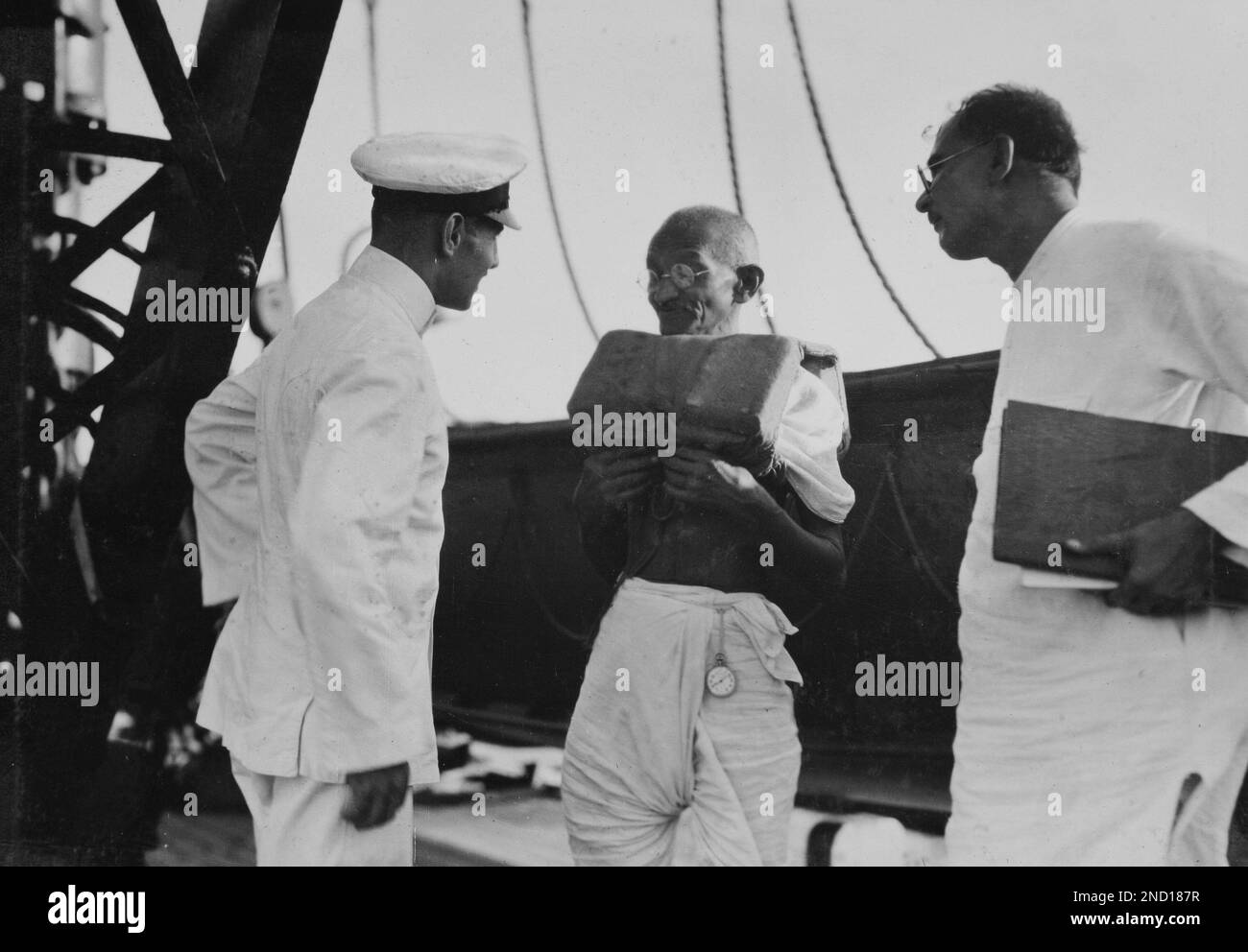 Mahatma Gandhi (center) and Mahadev Desai (right) receiving ...