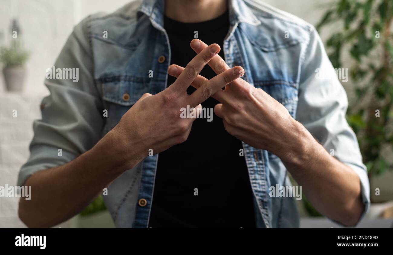Adult Learning Sign Language For Deaf Disabled Stock Photo - Alamy
