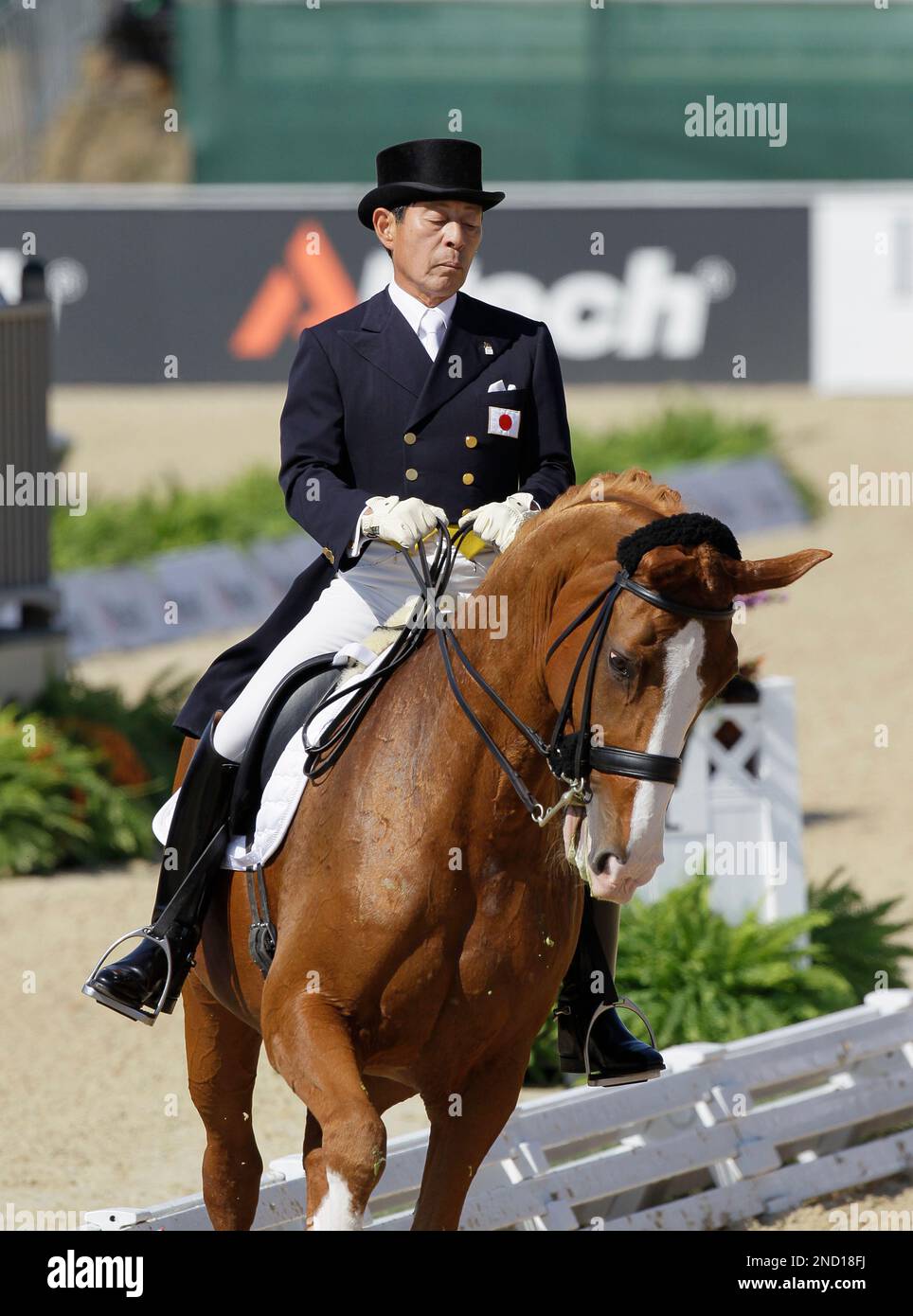 Hiroshi Hoketsu of Japan rides Whisper 115 during the Dressage event at ...