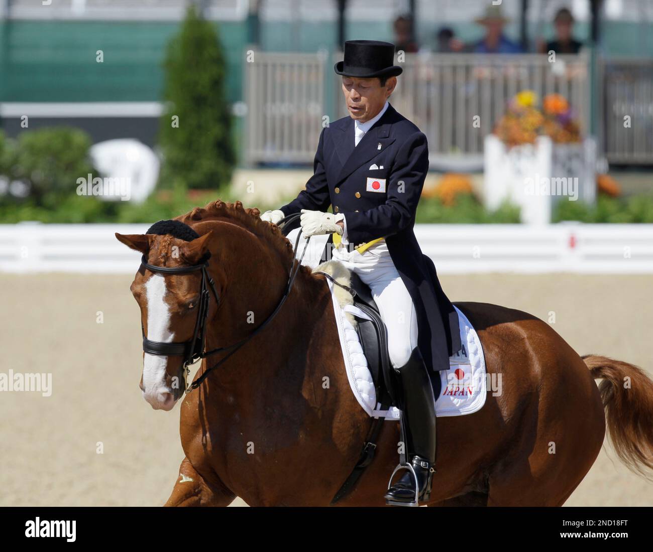 Hiroshi Hoketsu of Japan rides Whisper 115 during the Dressage event at ...