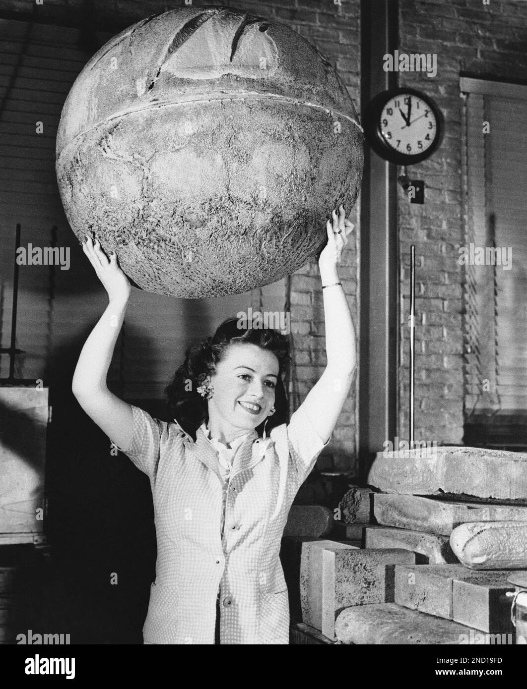 Mrs. Dorothy Barker easily holds a 29-inch sphere of the lightweight ...