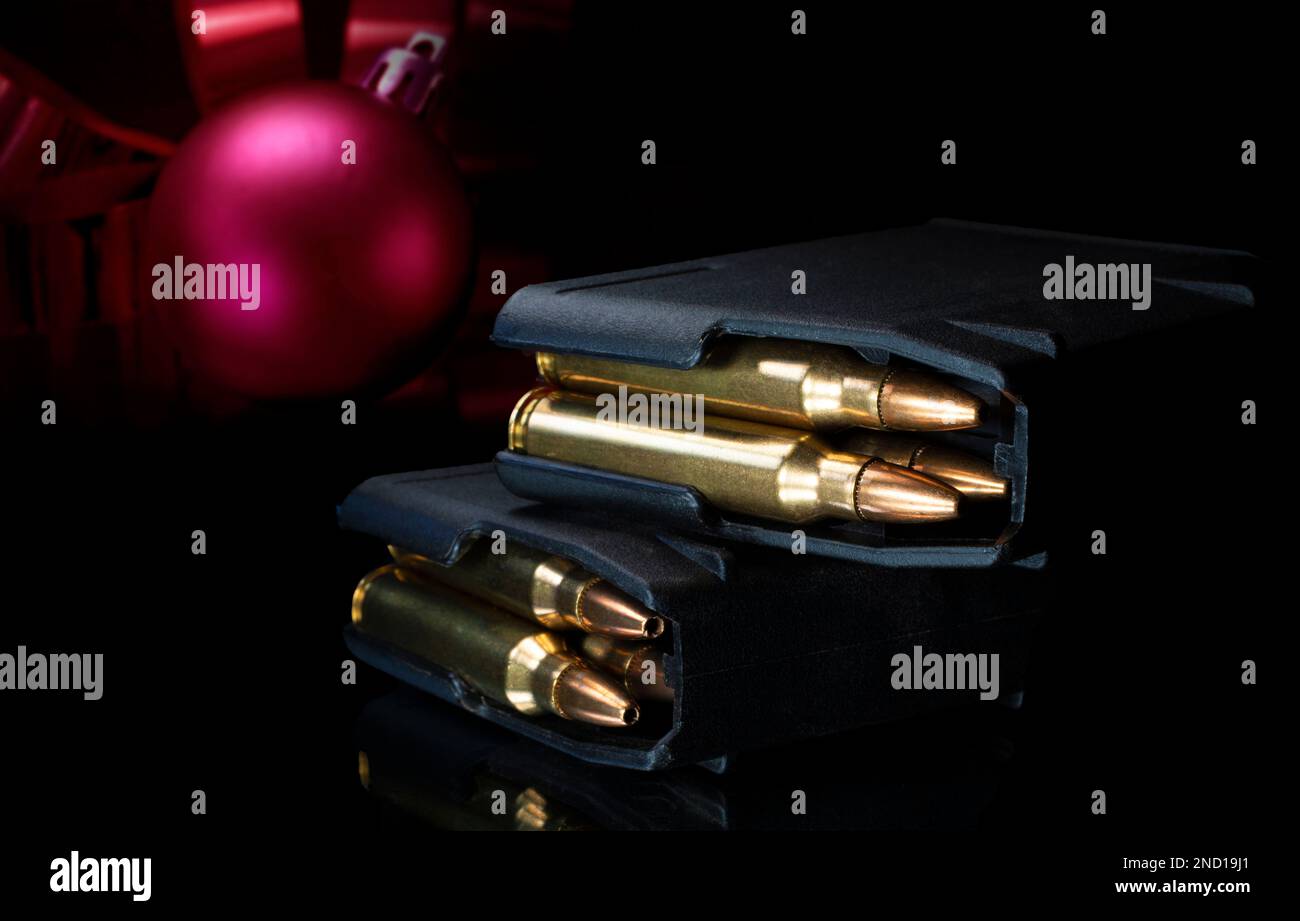 Loaded AR-15 magazines with a red Christmas ornament Stock Photo - Alamy
