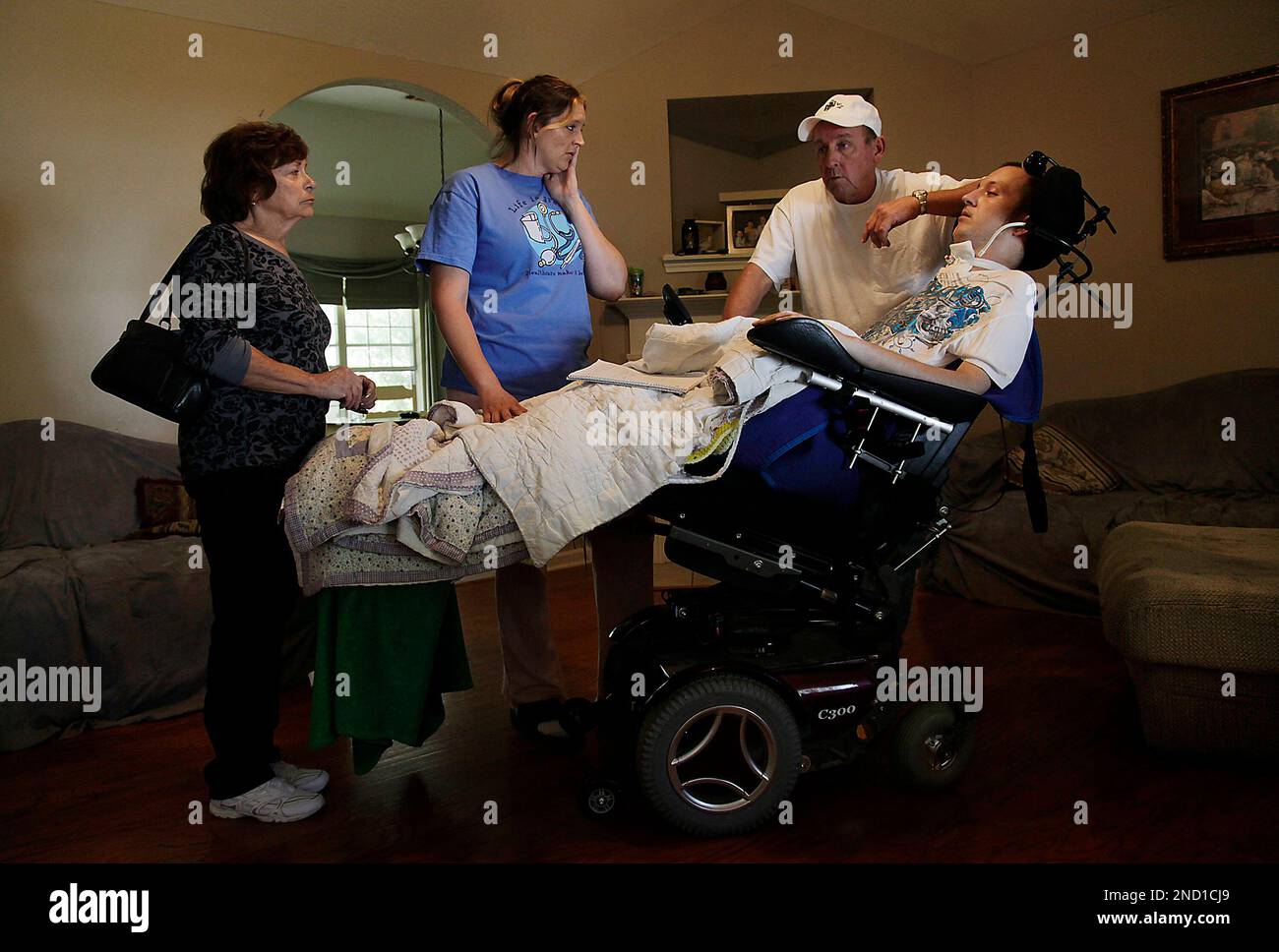 Quadriplegic Brandon Byrd of Atoka, Tenn., right, talks with his father ...