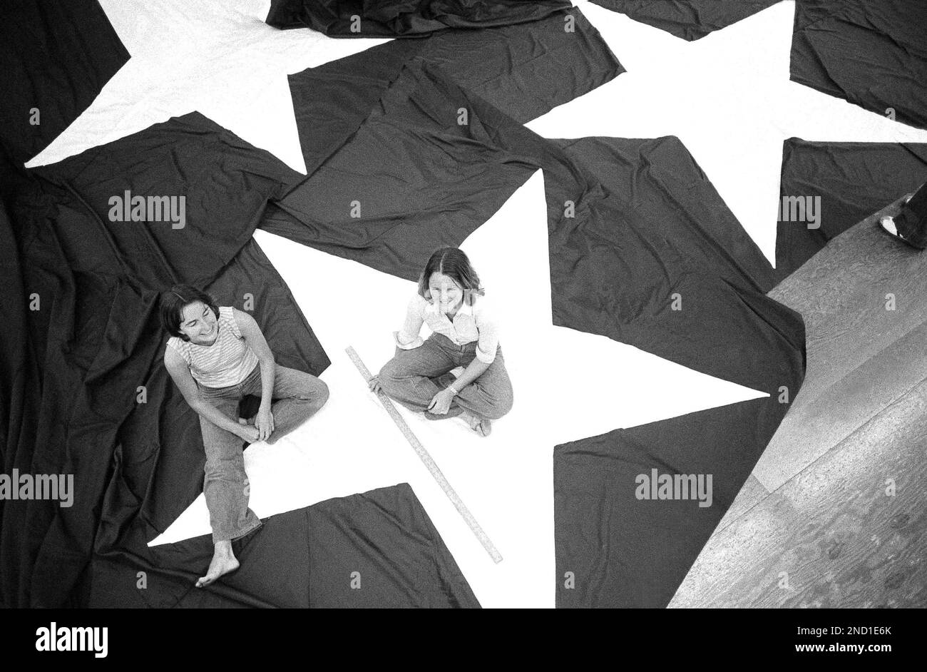 Debora Bullan, left, and Laurie Cardinale work among the stars, sewing ...