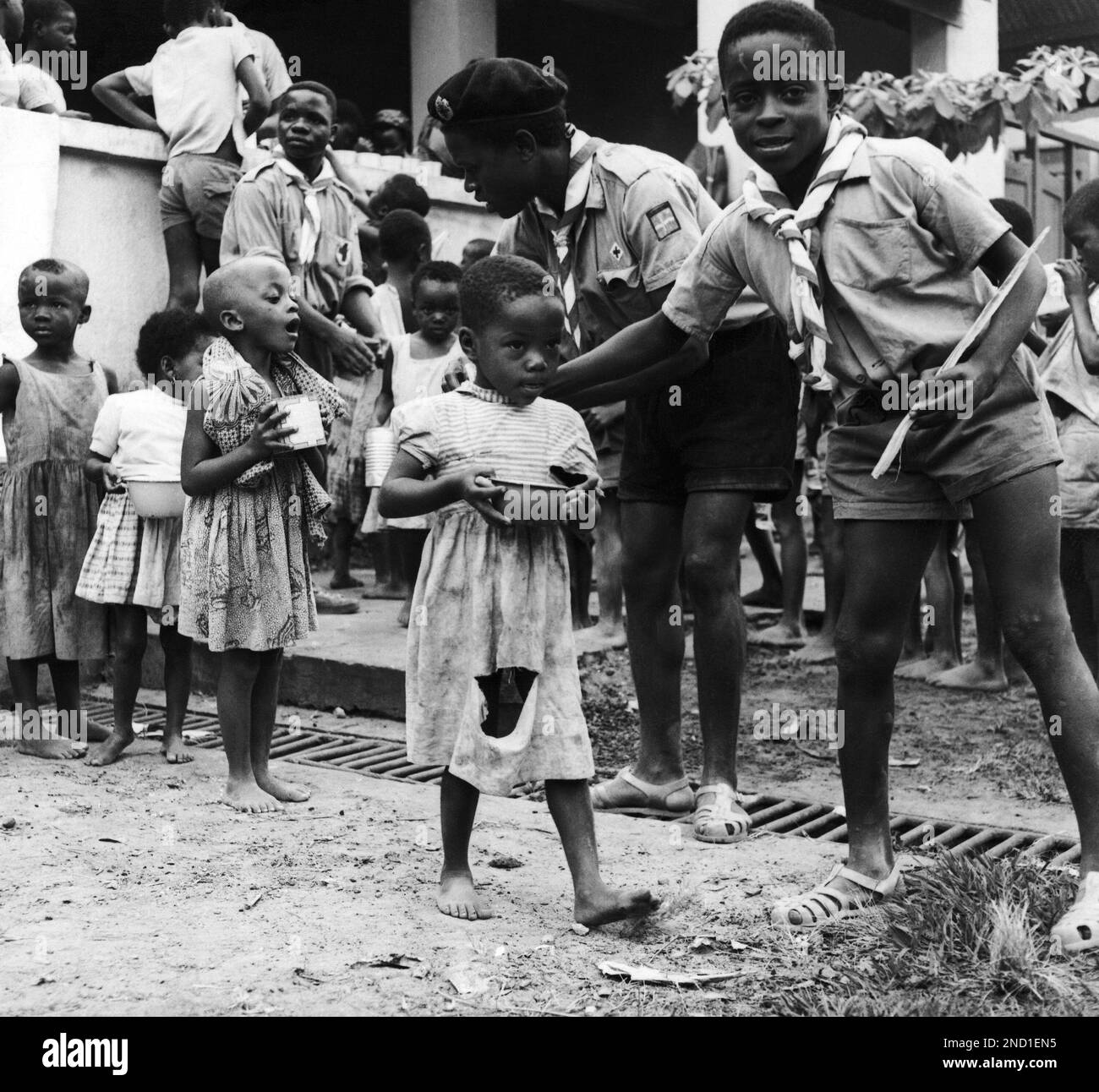 Boys of the Congolese junior Red Cross marshal younger children who ...