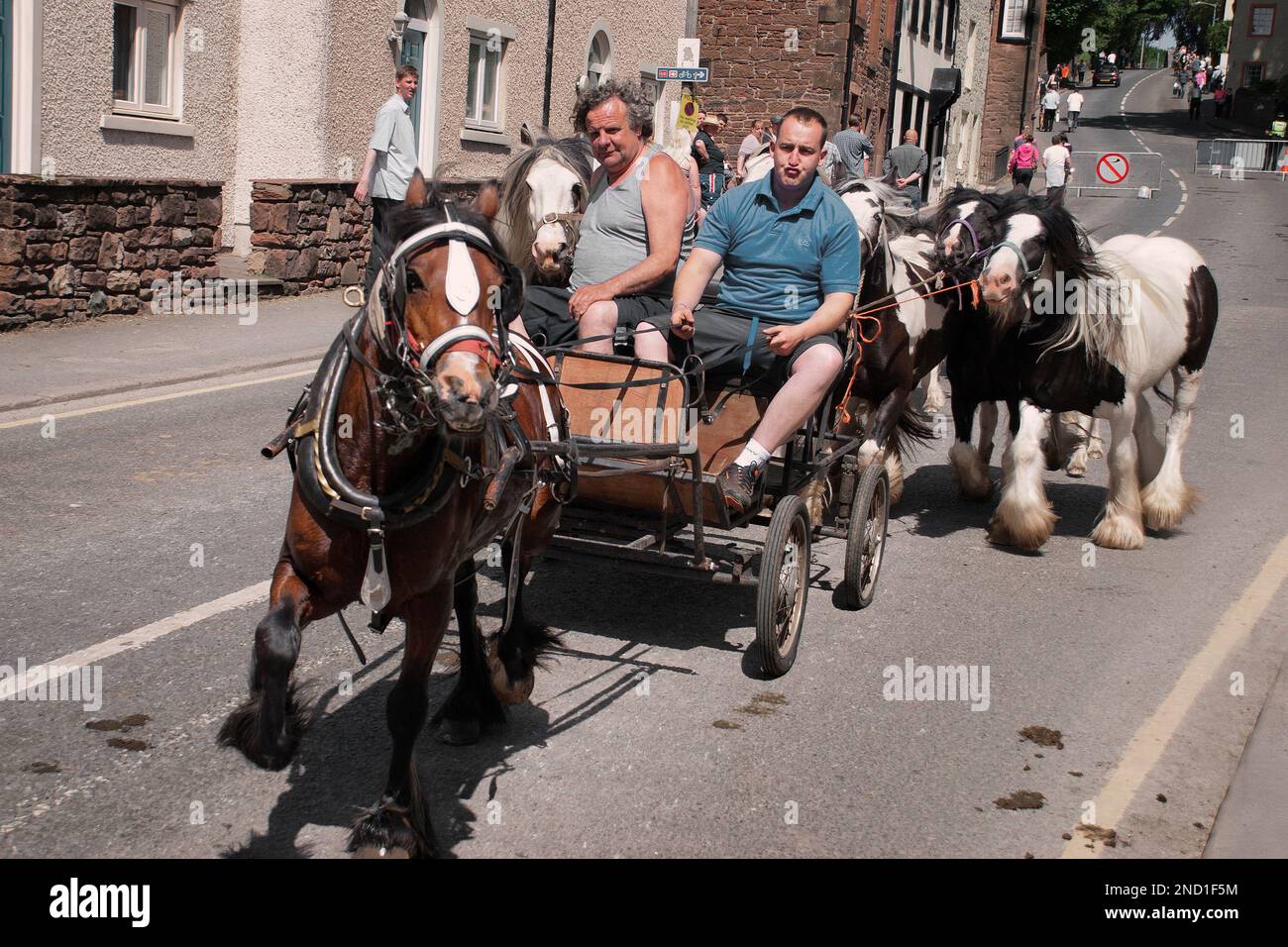 Horses and crts riven through the streets of appleby in hi-res stock ...