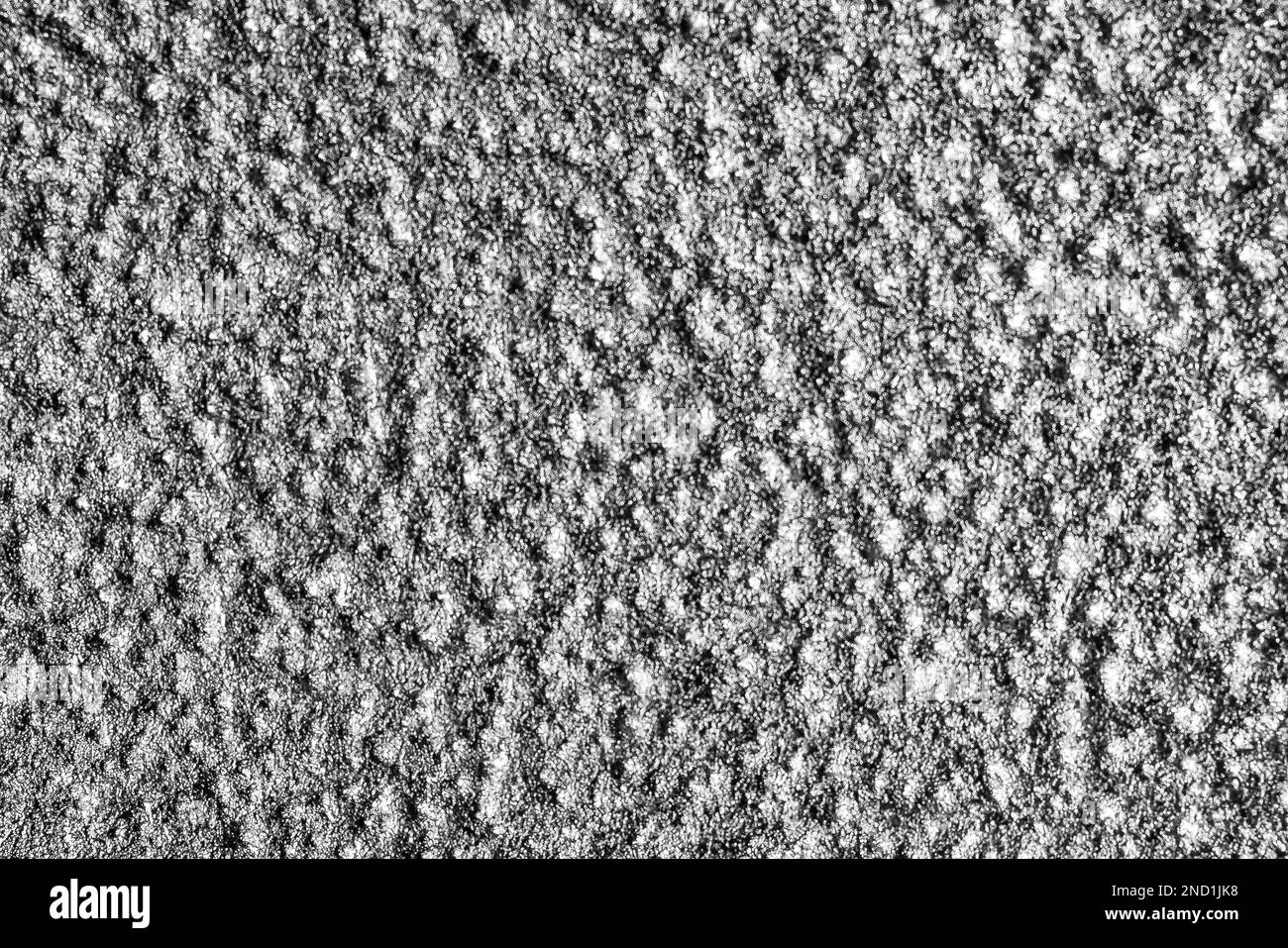 Monochrome texture of shiny grained metal. Abstract background for ...