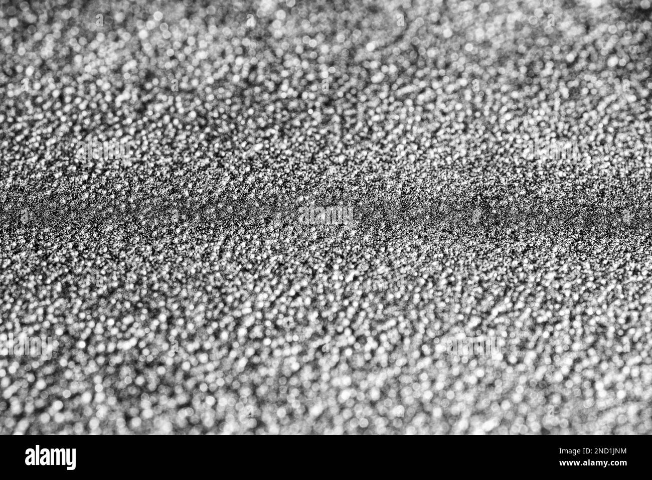 Monochrome texture of shiny grained metal. Abstract background for ...