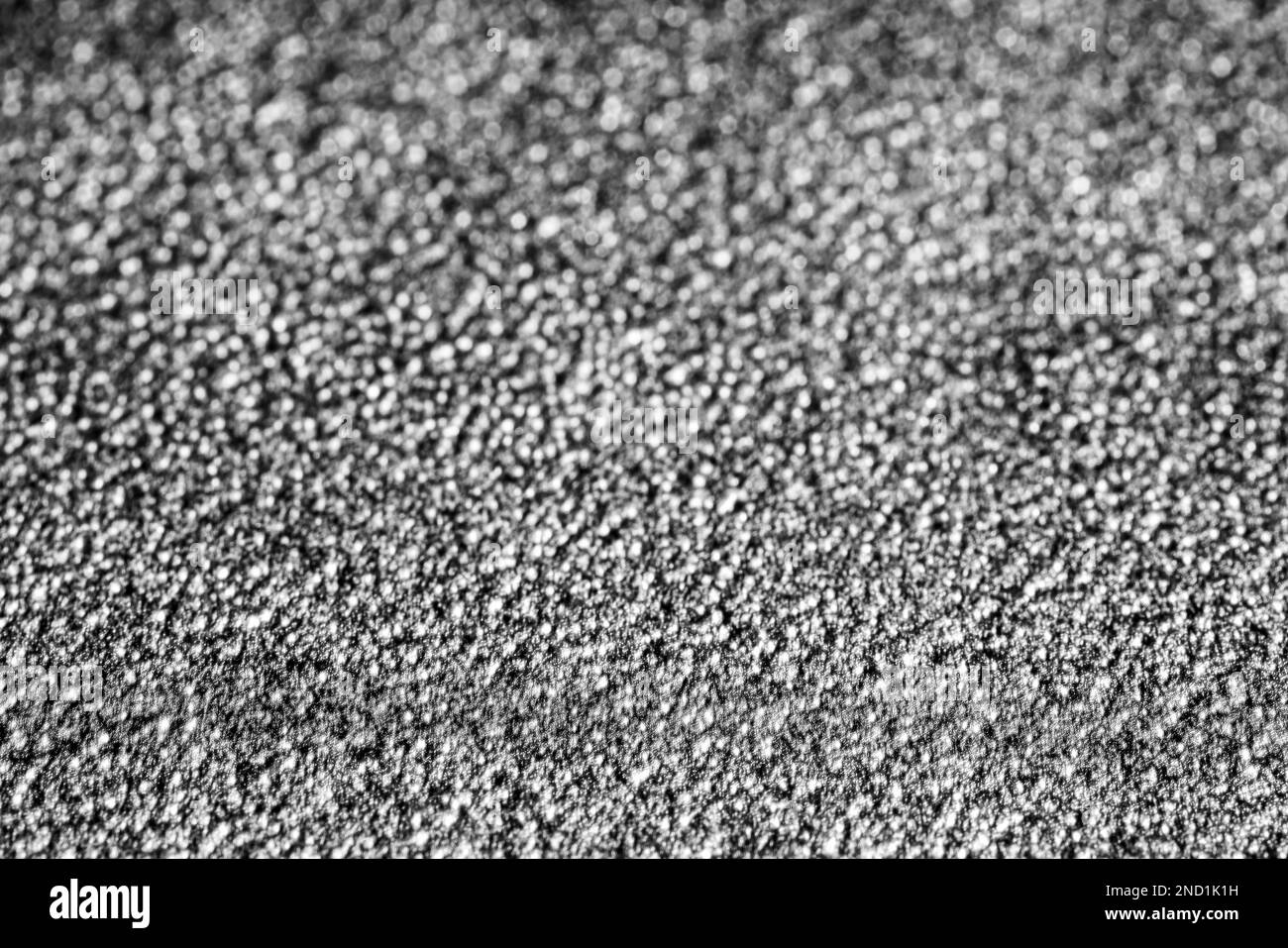 Monochrome texture of shiny grained metal. Abstract background for ...