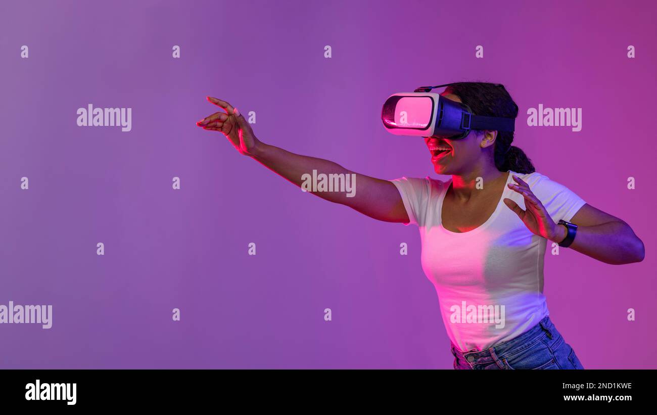 Cheerful Black Female Experiencing Virtual Reality In Modern Vr Glasses Stock Photo - Alamy