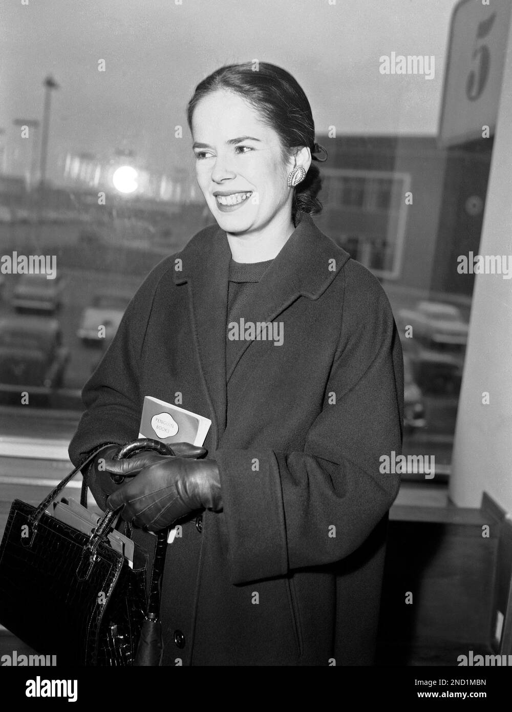 Charlie Chaplin’s wife Oona at London airport on March 17, 1959 as she ...