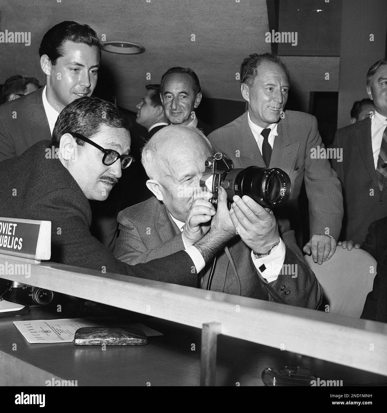 Soviet Premier Nikita S. Khrushchev looks through range finder of 35mm ...