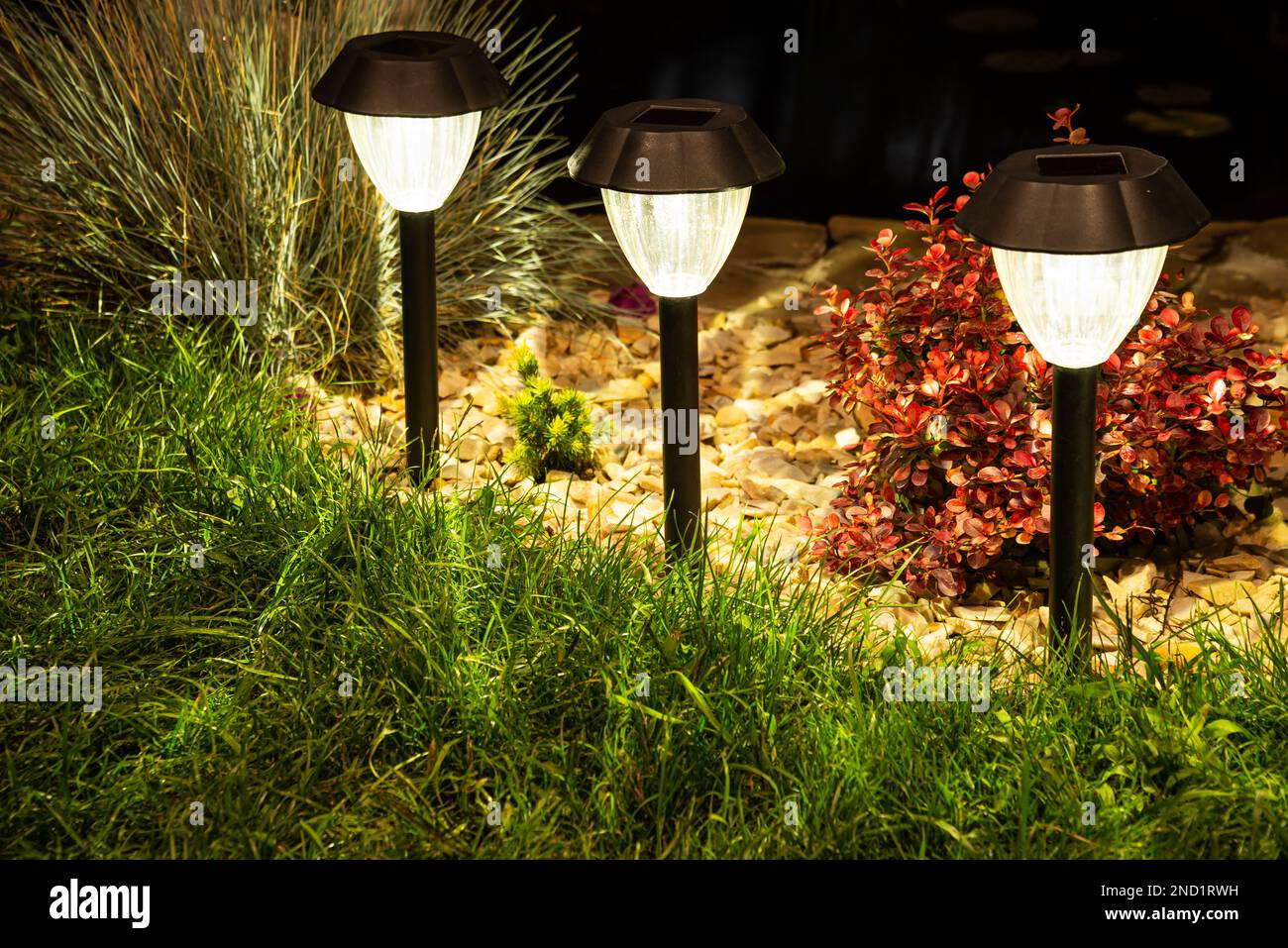 Decorative Small Solar Garden Light, Lanterns In Flower Bed. Garden ...
