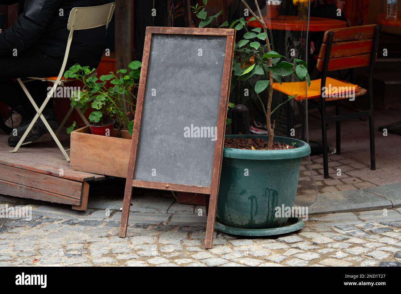 Wooden signboard for cafe on a street Stock Photo - Alamy