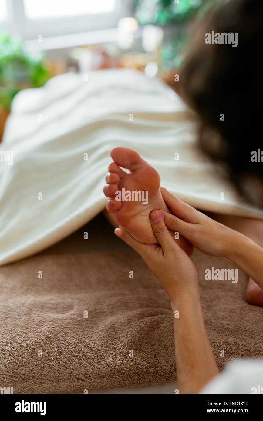 Crop Unrecognizable Masseuse Massaging Feet Of Antonymous Female Client
