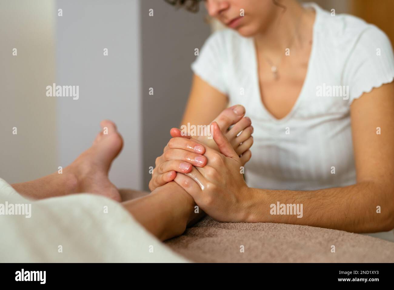 Crop Unrecognizable Masseuse Massaging Feet Of Antonymous Female Client