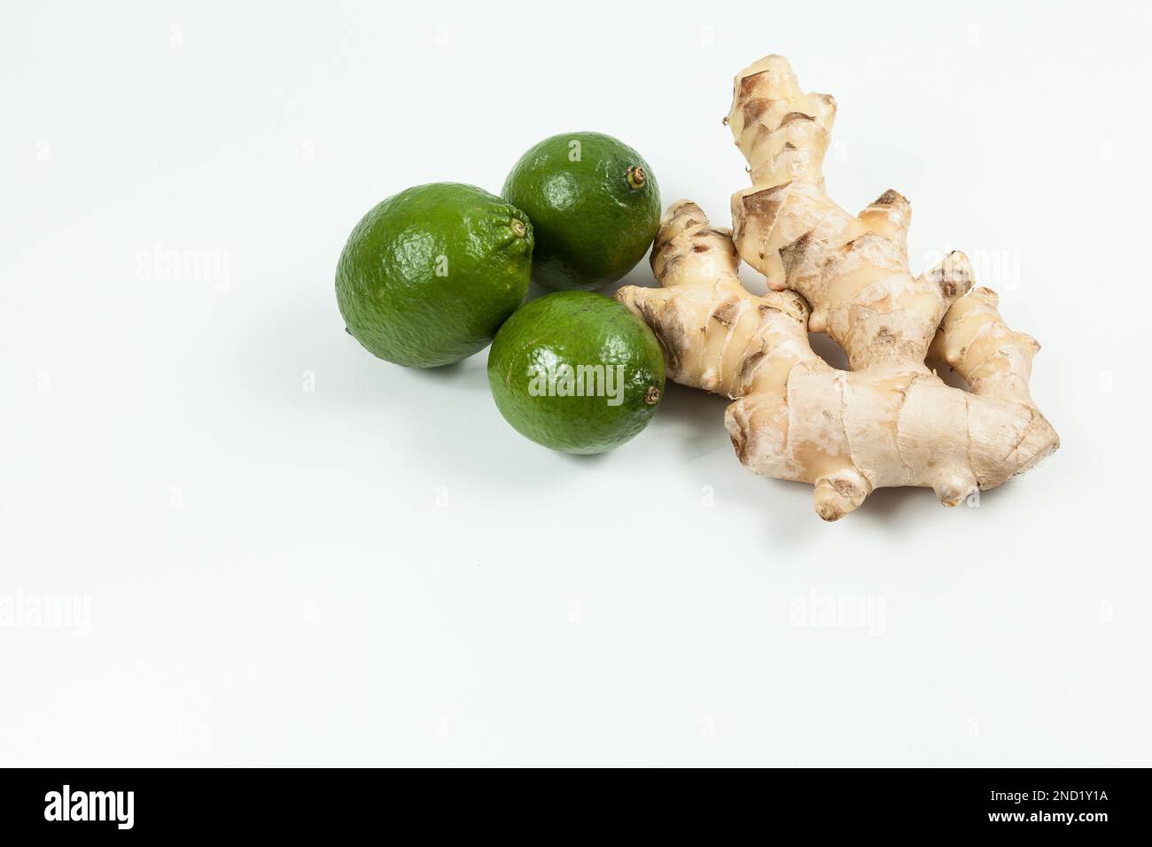 Ginger and lemons root; photo on neutral background Stock Photo - Alamy