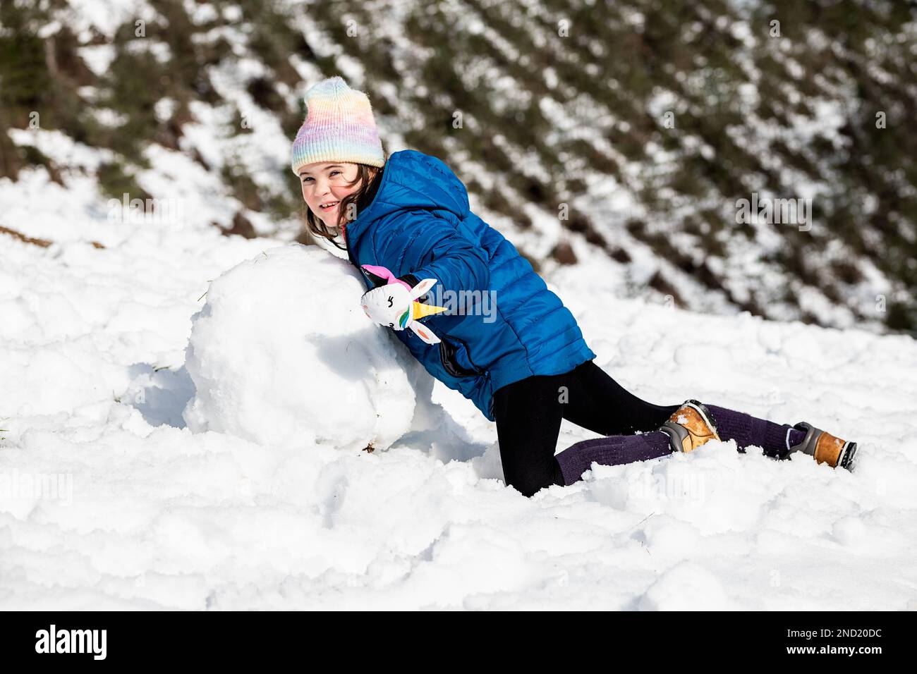 Full body side view of positive girl in outerwear and hat making ...