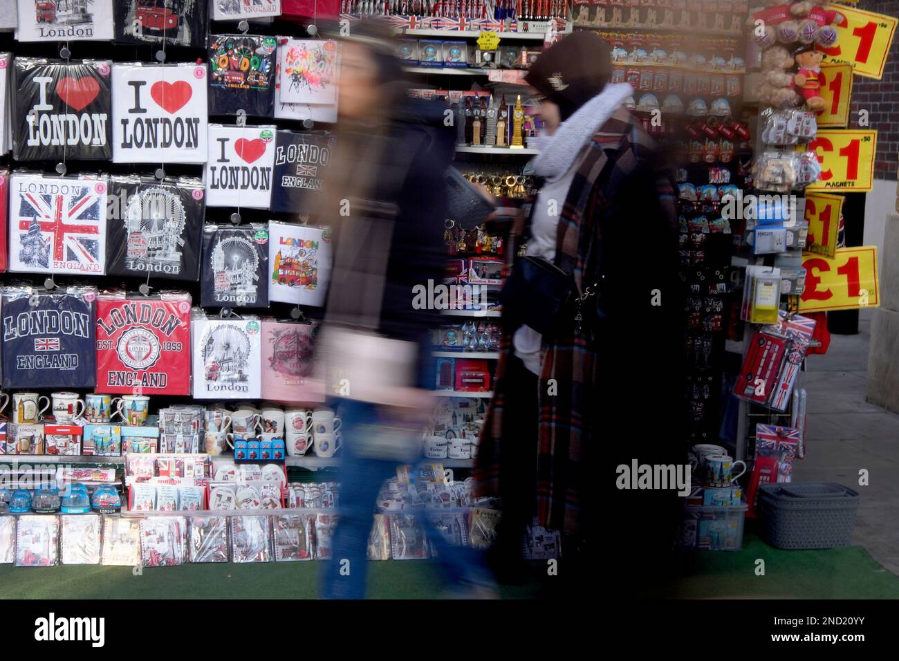 Shoppers pass a souvenir stall on Oxford Street in London, Wednesday ...