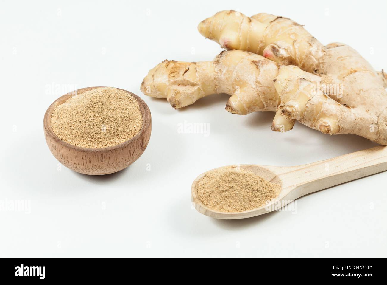 Fresh roots and ginger powder - Zingiber officinale; photo on wooden ...