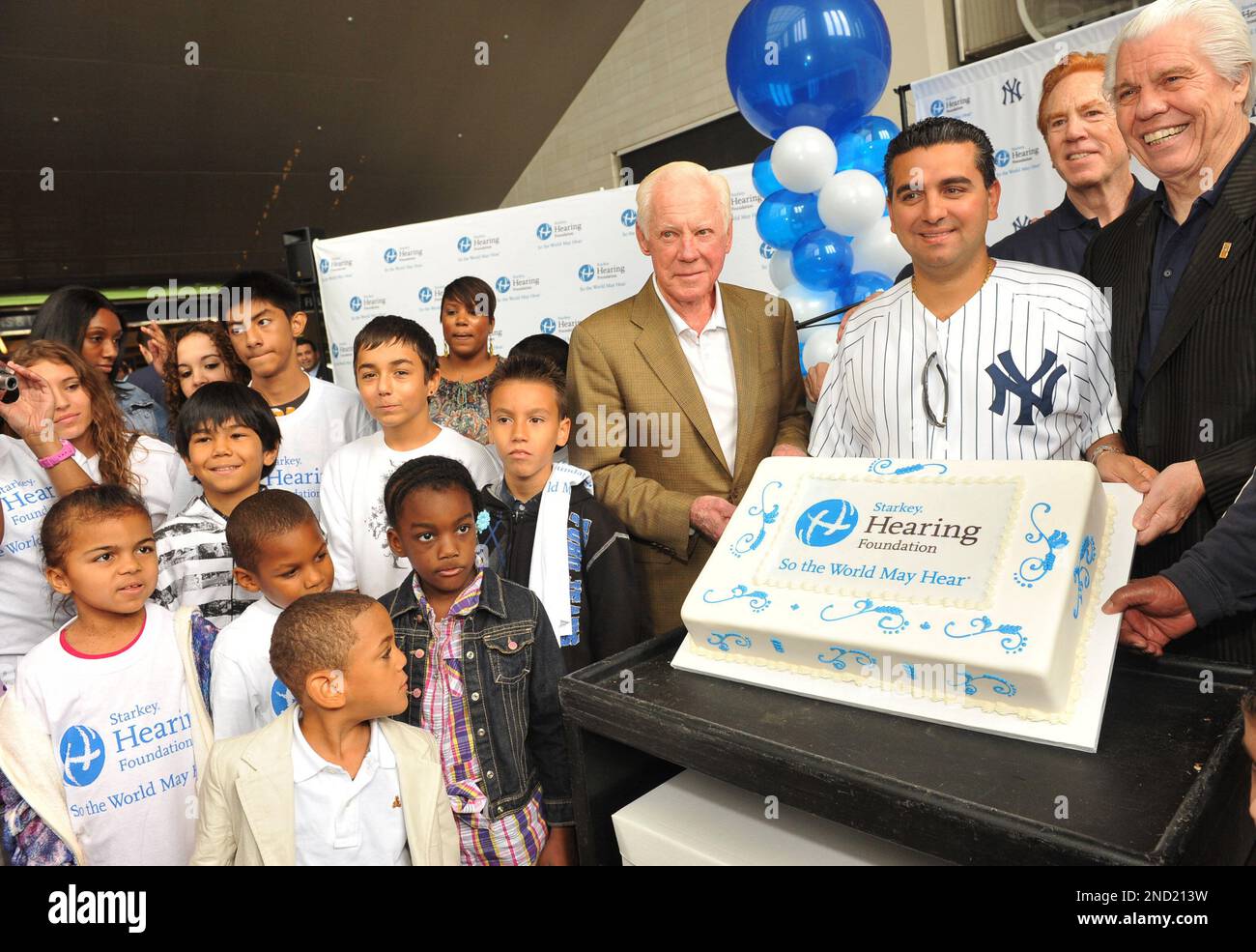 Buddy "Cake Boss" Valastro presents a cake to The Starkey Hearing ...
