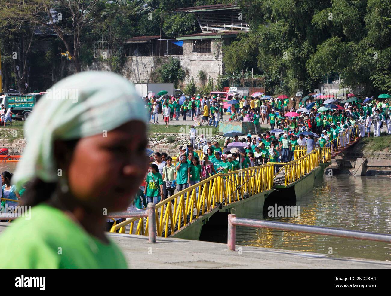 Residents cross the rehabilitated Marikina River using an improvised ...