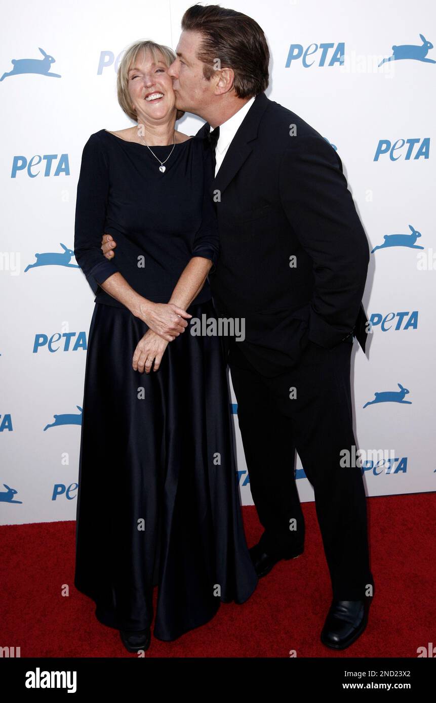 Actor Alec Baldwin, right, kisses PETA president Ingrid Newkirk, at ...