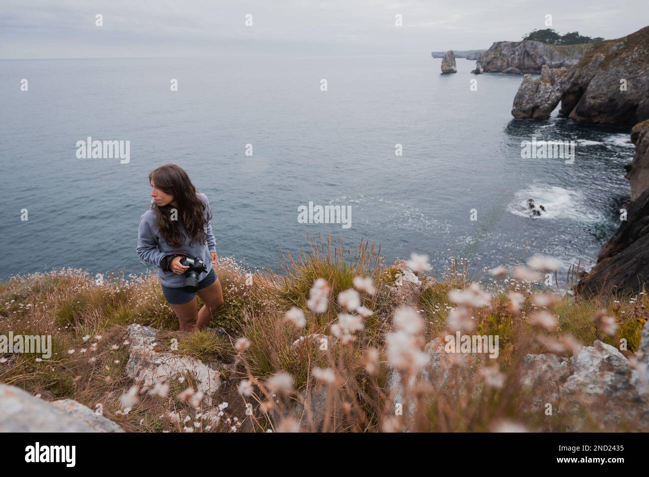 High angle full body of young female photographer with professional ...