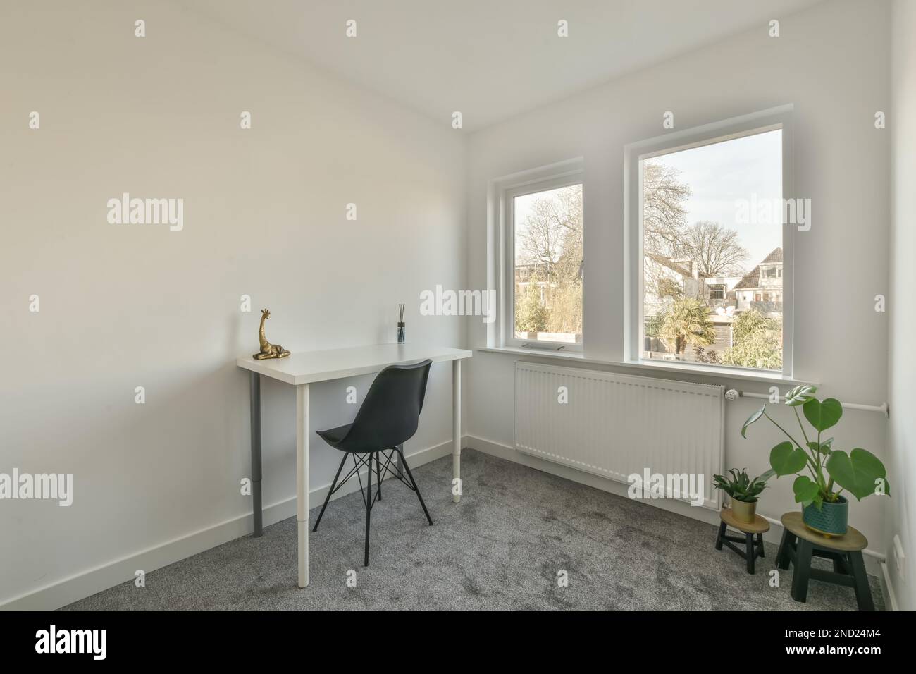 Interior design of modern room with desk table and chair placed near ...